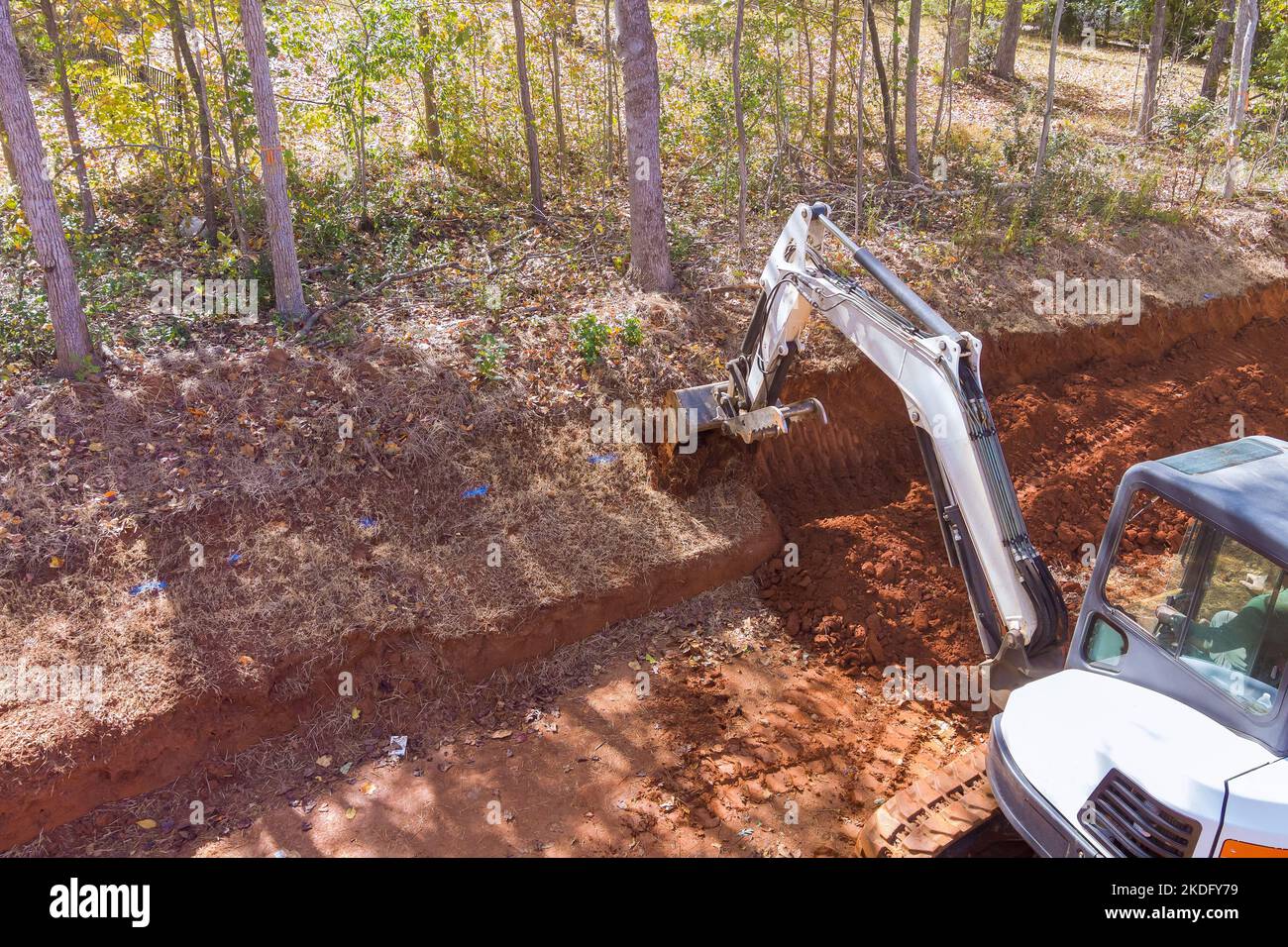 Construction site excavation buckets of crawler excavator digging into ...