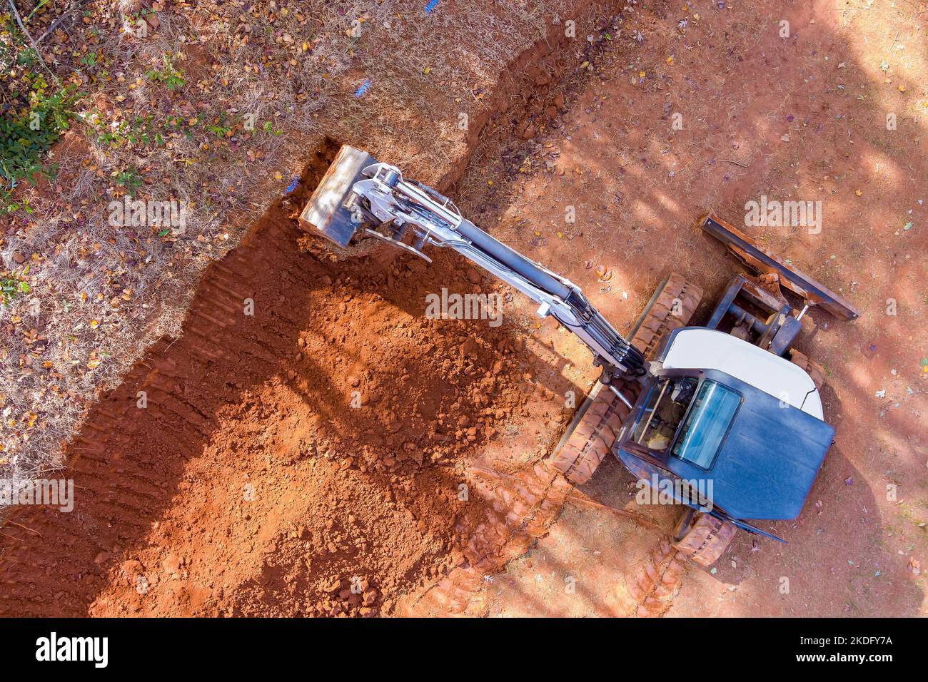 At construction site, crawler excavators are digging ground during ...