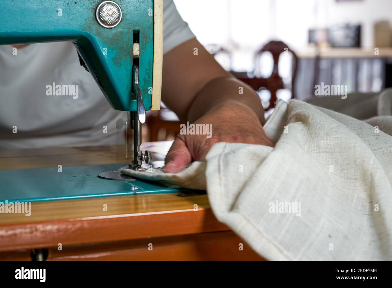 Woman using industrial sewing machine hi-res stock photography and ...