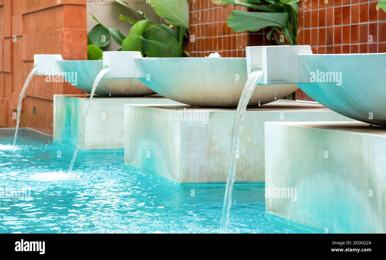 Waterfall jet at the swimming pool on daytime Stock Photo - Alamy
