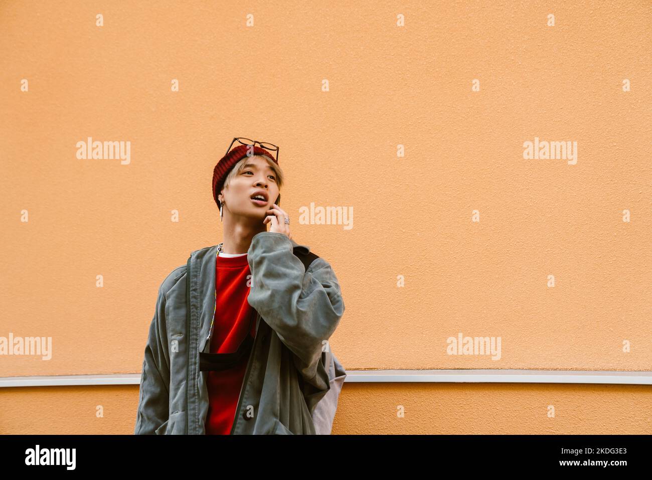 Asian teen boy talking on phone hi-res stock photography and images - Alamy