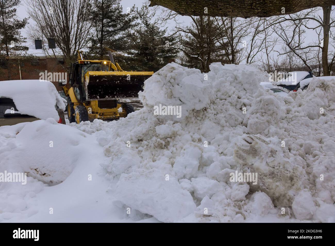Snow blizzard clean up of snow with tractor after huge snowstorm in ...