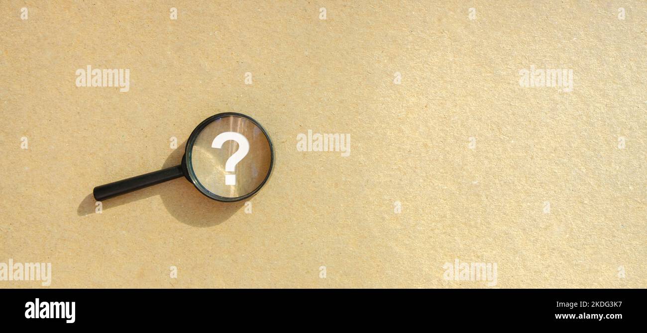 Magnifying glass with a question mark. Looking for an answer. Search ...
