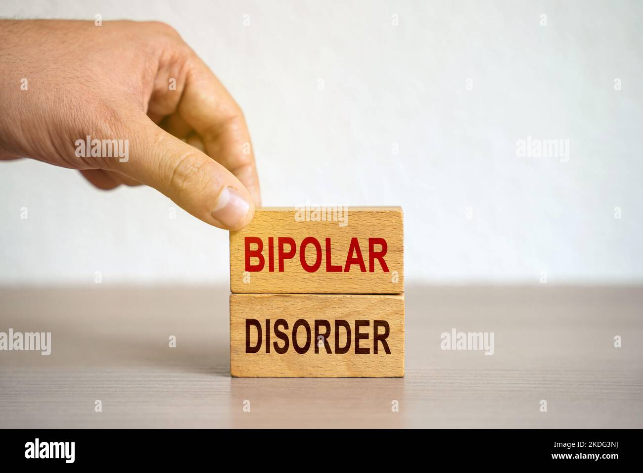 Hand puts blocks with the words Bipolar Disorder - manic depression ...