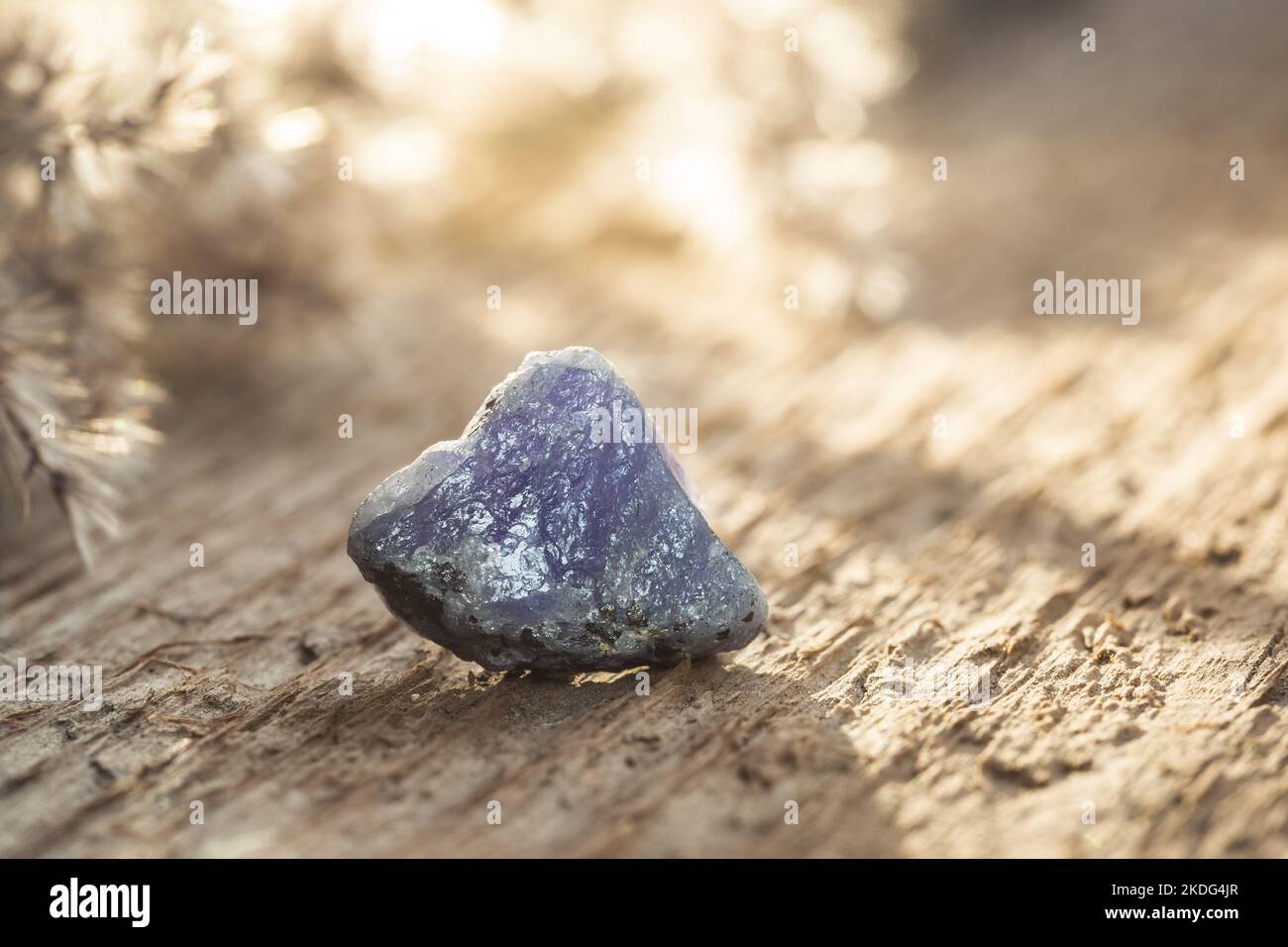 Rough Uncut Blue and Violet Tanzanite Gem on Wooden Background ...