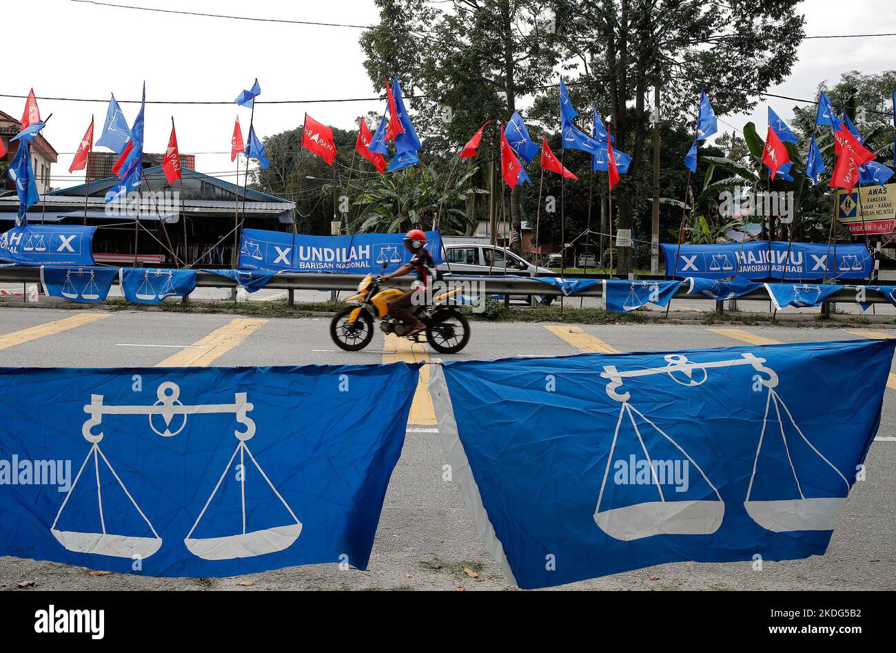 Kuala Lumpur, Malaysia. 6th Nov, 2022. A motorcyclist rides past the ...