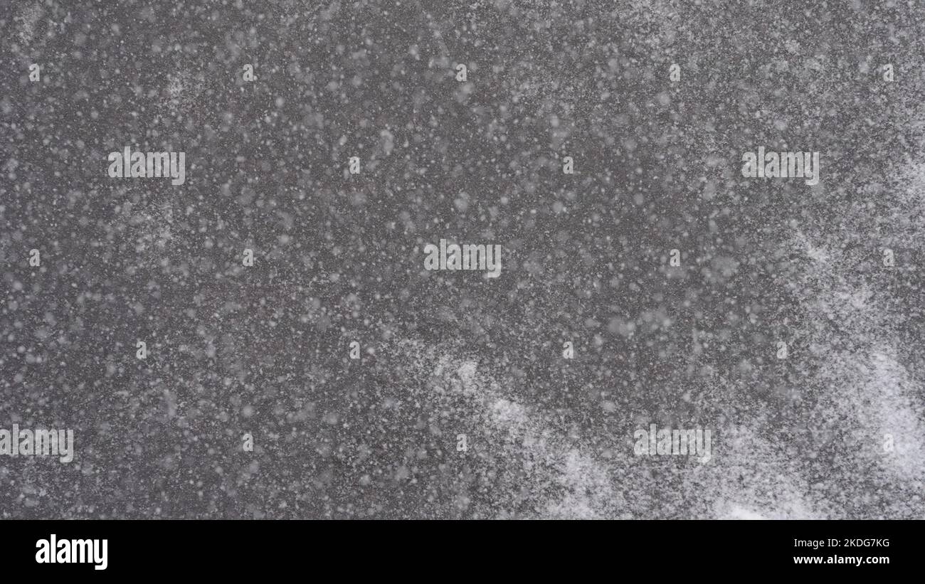 snow falling on asphalt from above, wide photo Stock Photo - Alamy