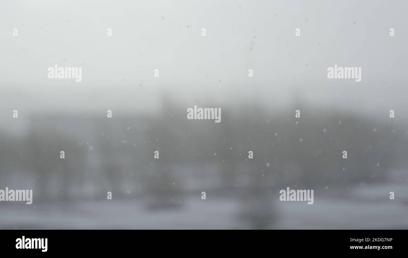 snow falling with blurred bacground, wide photo Stock Photo - Alamy
