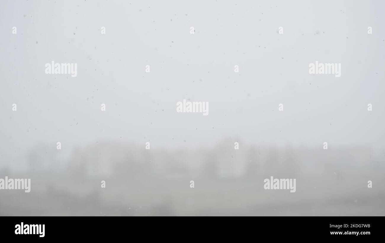 snow falling with blurred bacground, wide photo Stock Photo - Alamy