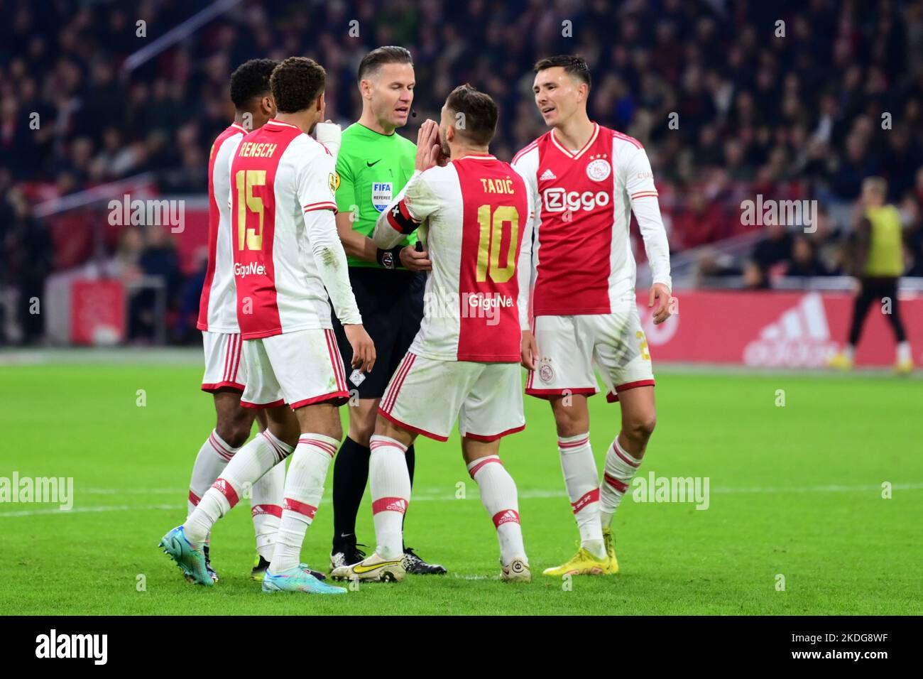 AMSTERDAM - (lr) Jurrien Timber of Ajax, referee Danny Makkelie, Dusan Tadic of Ajax, Steven ...