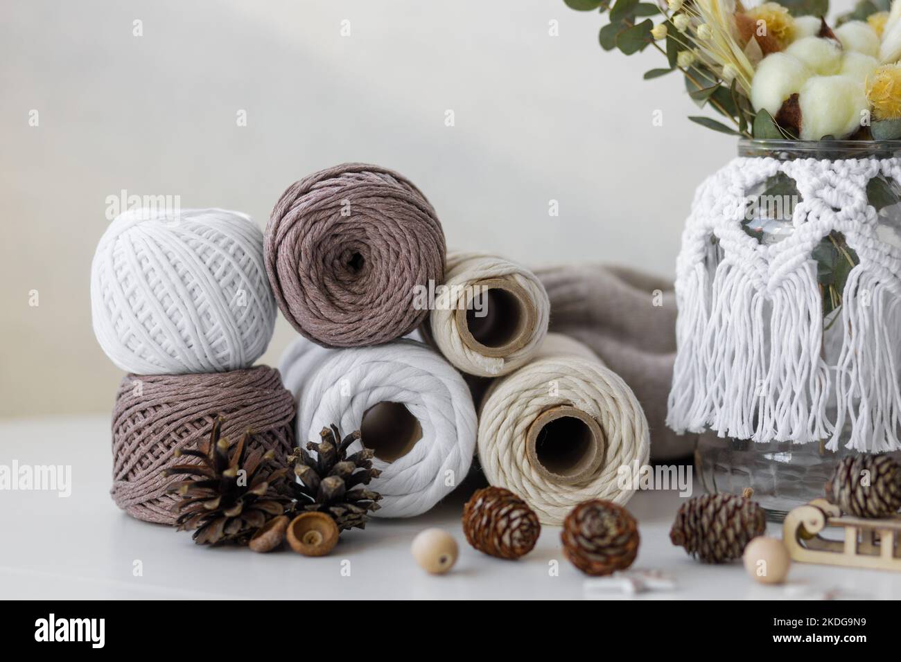 A composition with balls of threads of different colors, cones, sledges ...