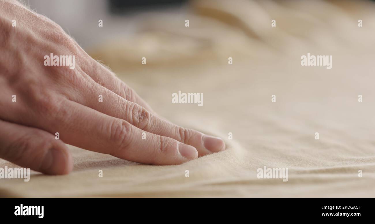Finger touching cloth hi-res stock photography and images - Alamy
