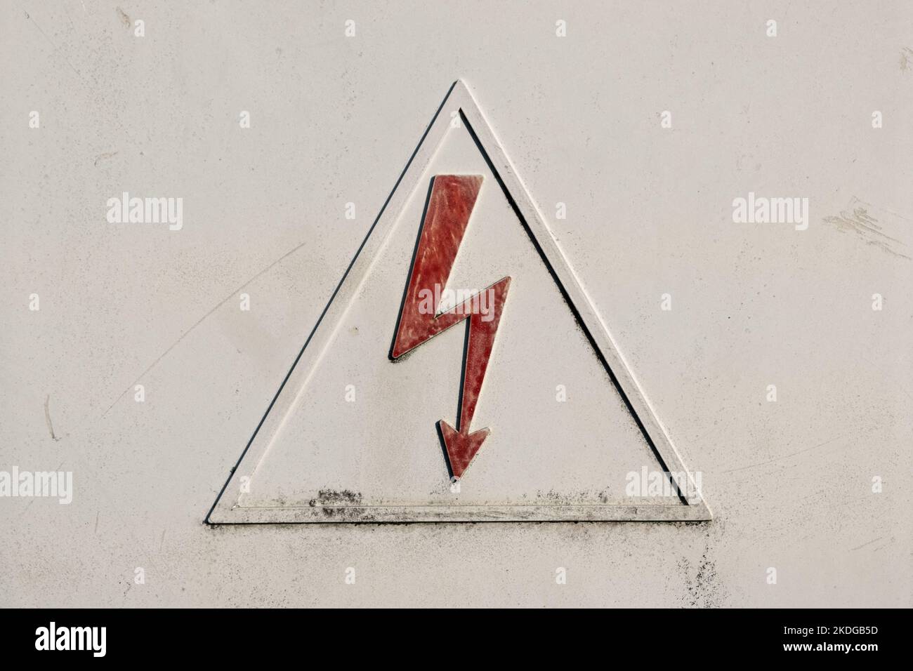 aged High Voltage triangular Sign. Danger Electrical Hazard Stock Photo ...