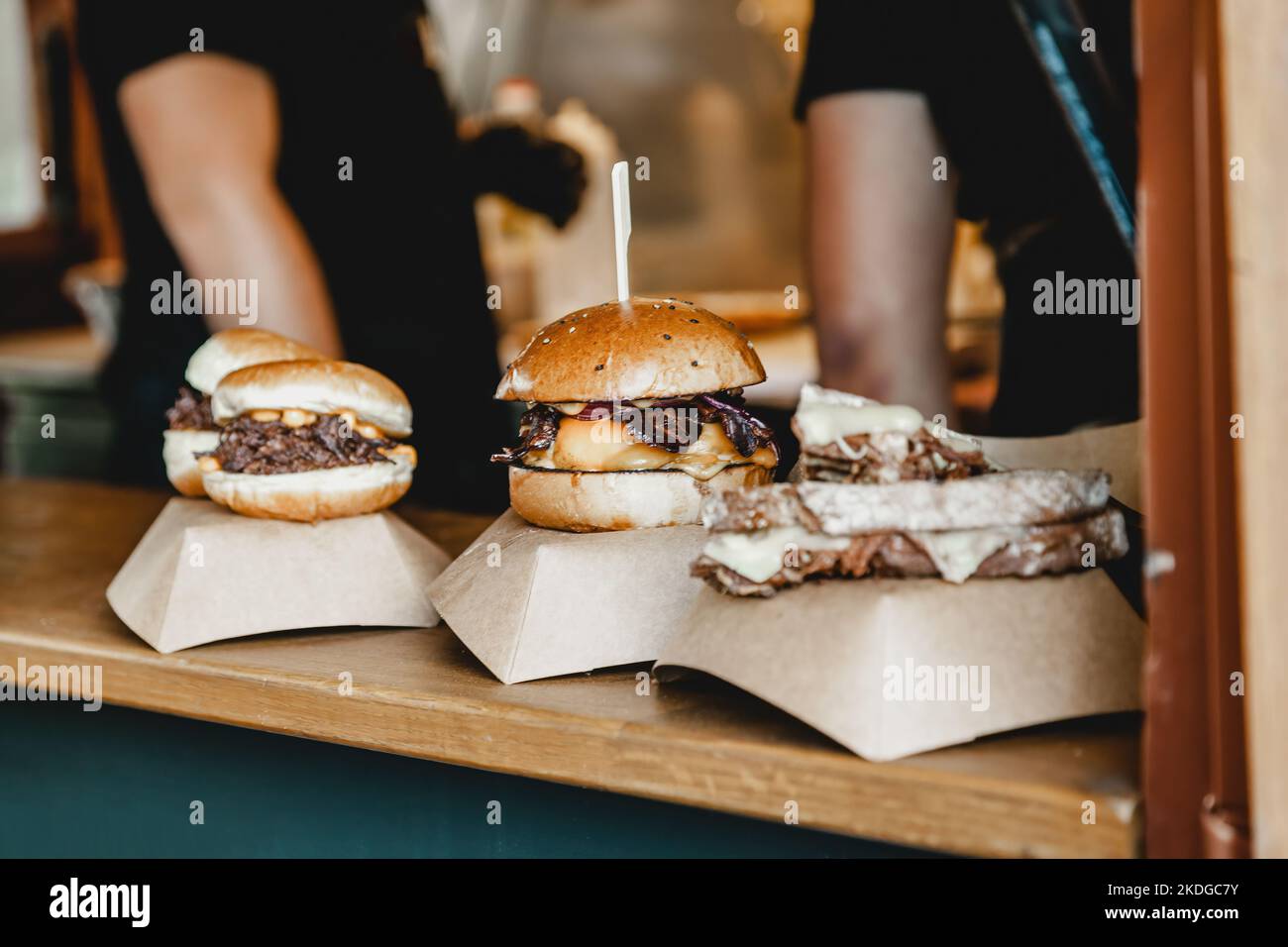 Burgers at a burger feast. Dinner Hamburger Food Feast Party. Big ...