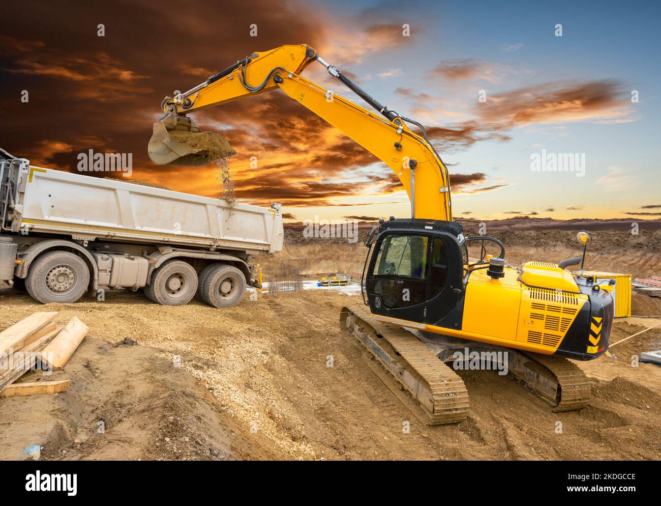excavator is digging at construction site Stock Photo - Alamy