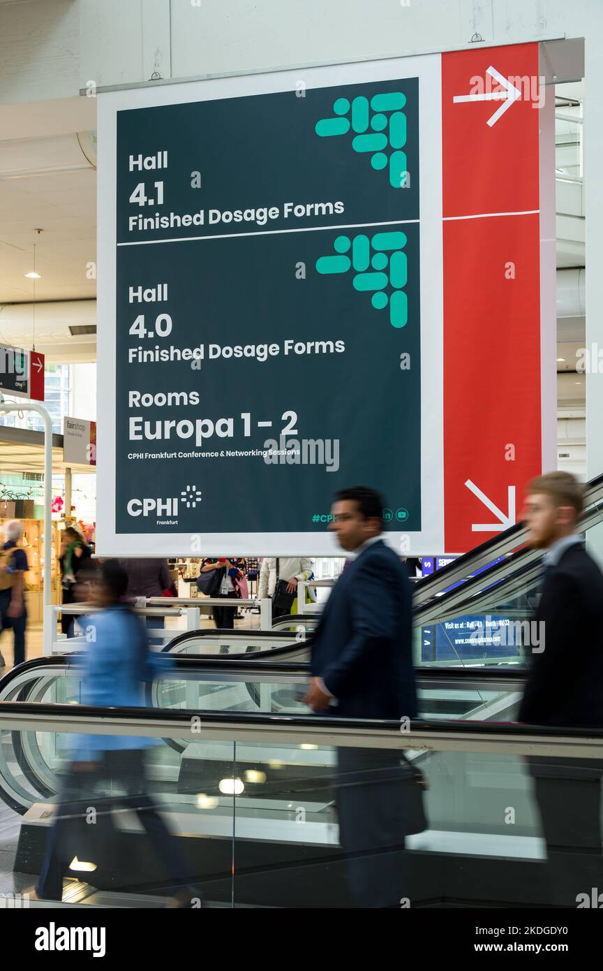 Visitors on escalator going past direction signs at CHPI 2022 in Messe ...