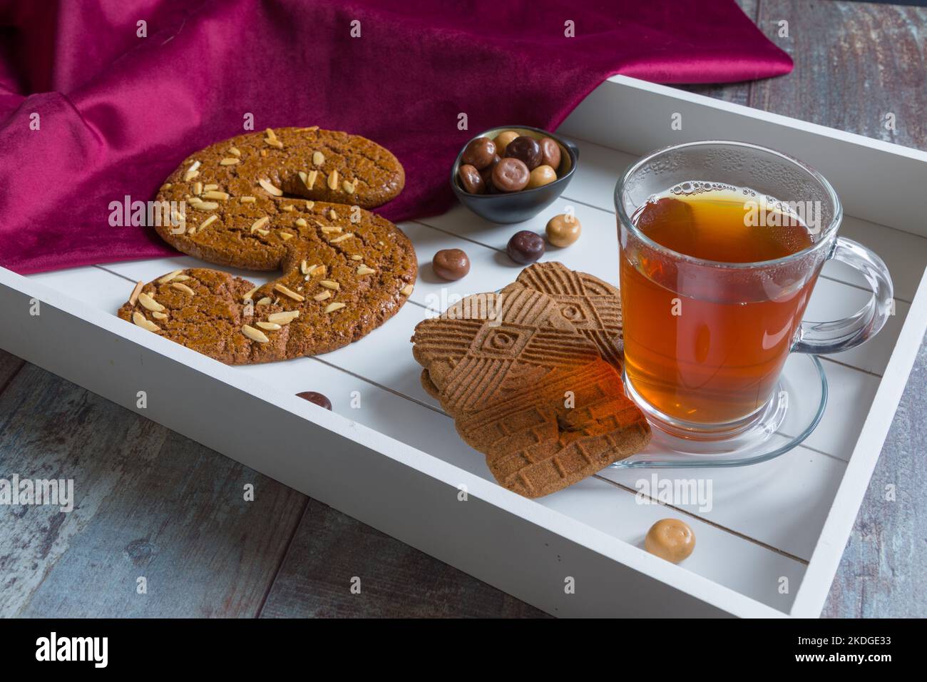 A cup of tea and spiced bisquit called speculaas on a tray to celebrate ...