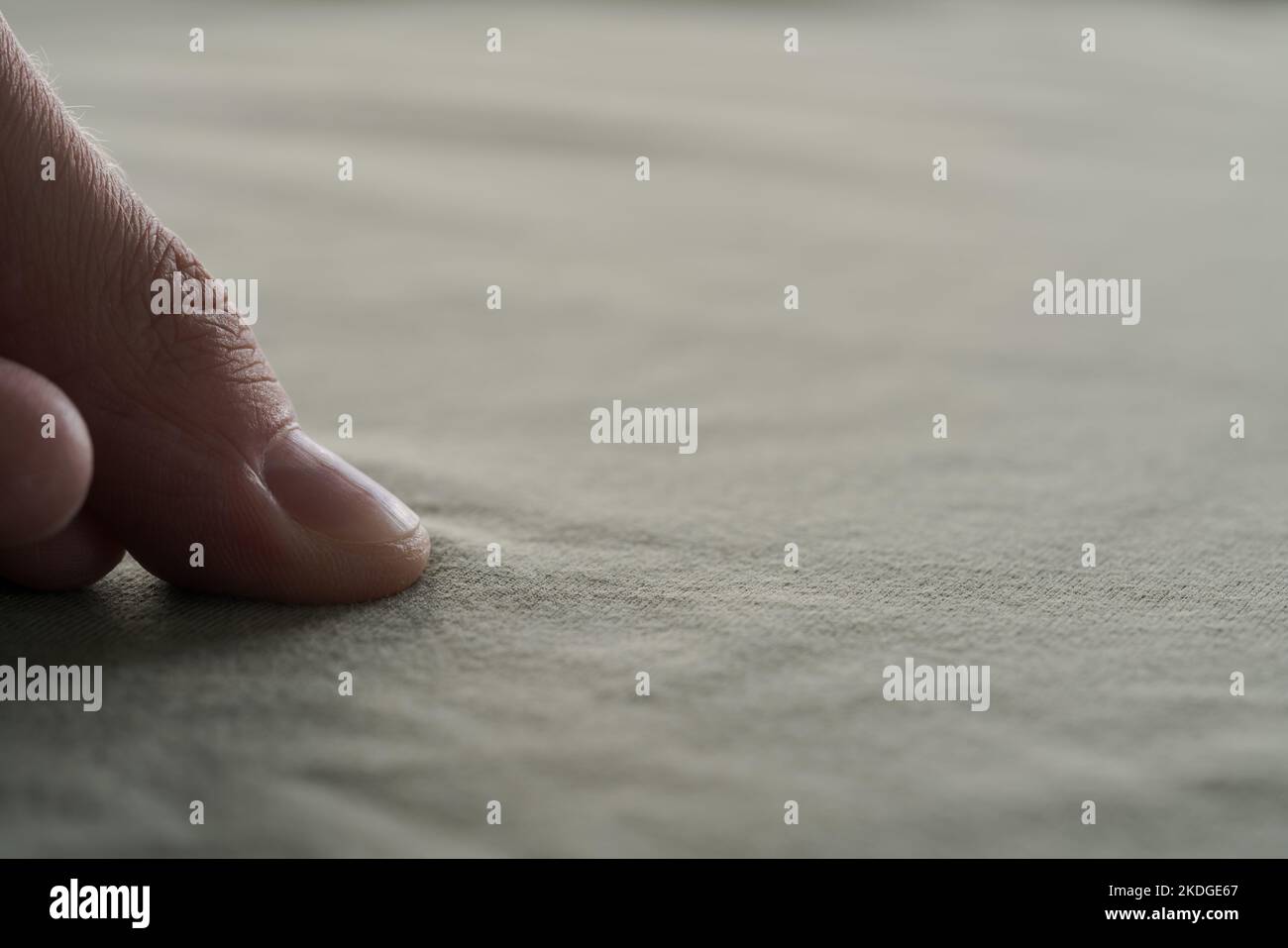 man hand touching green cotton fabric, shallow focus Stock Photo - Alamy