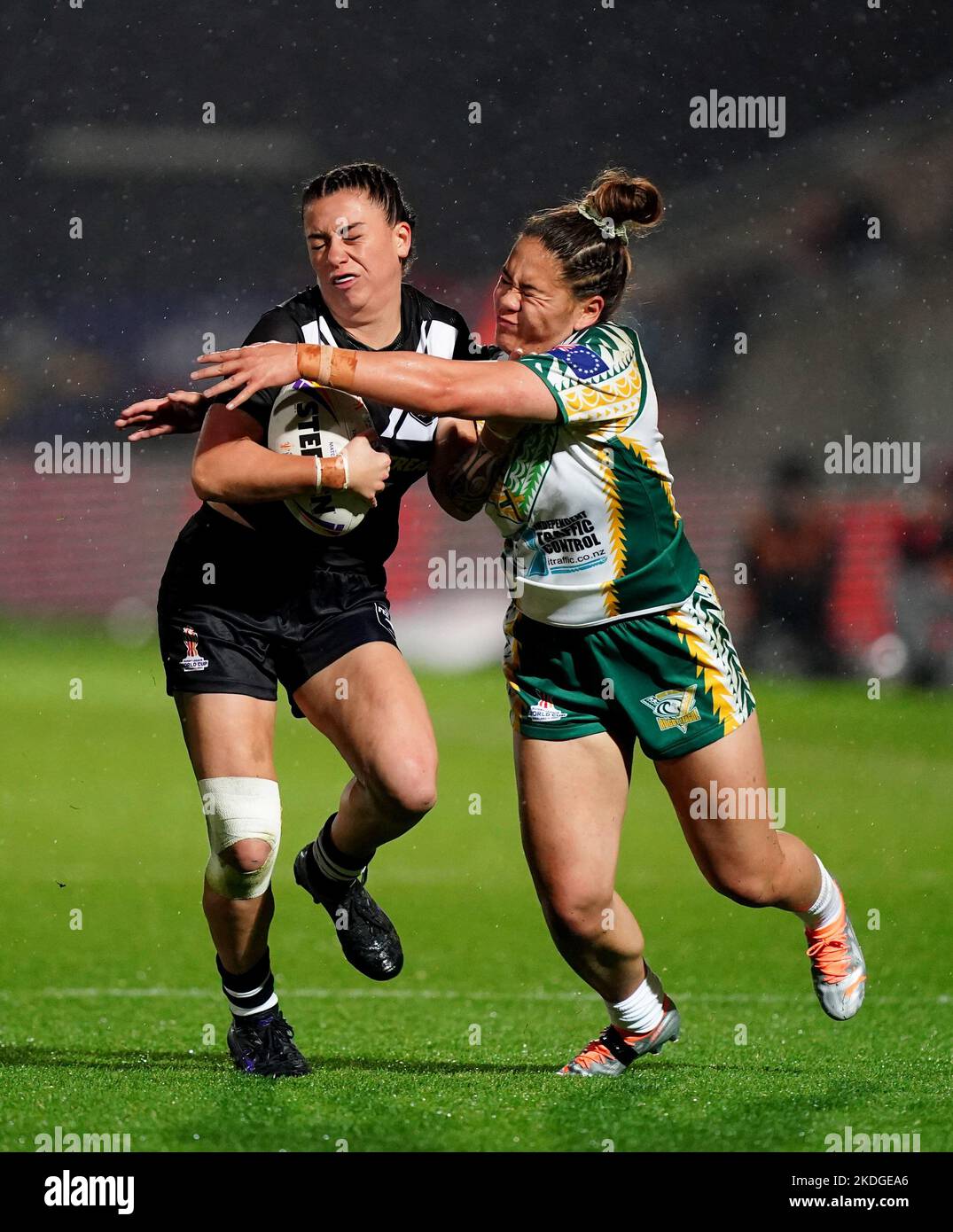 New Zealand’s Madison Bartlett (left) is tackled by Cook Islands ...