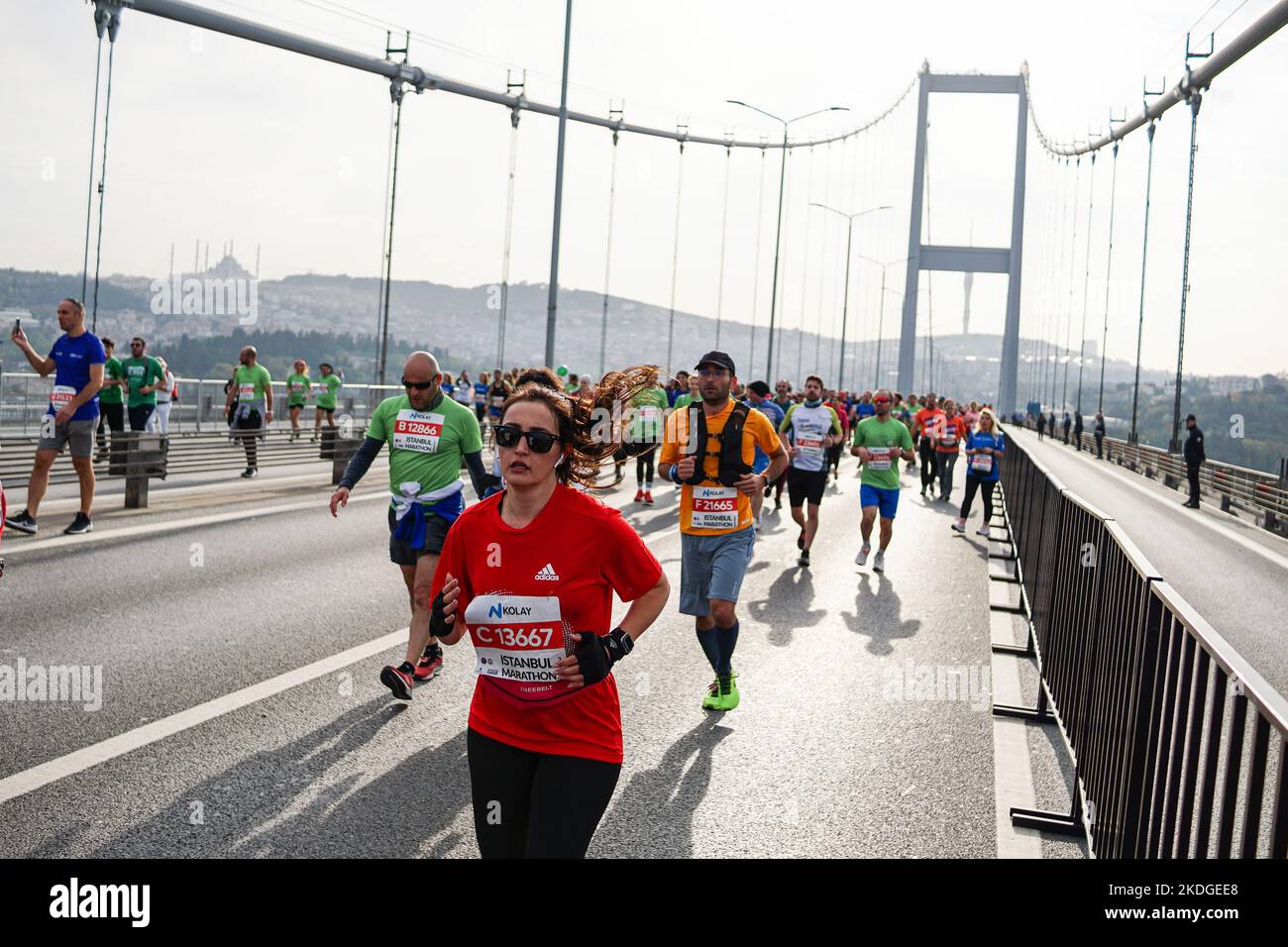 Athletes running on Bosphorus Bridge during the marathon. Istanbul ...