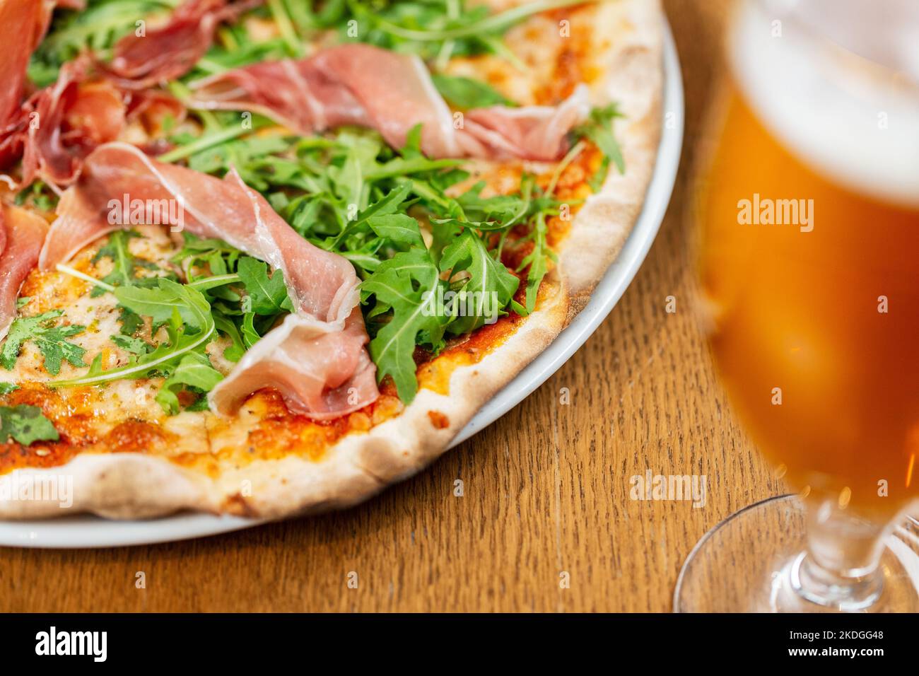 close up of pizza on wooden table Stock Photo - Alamy