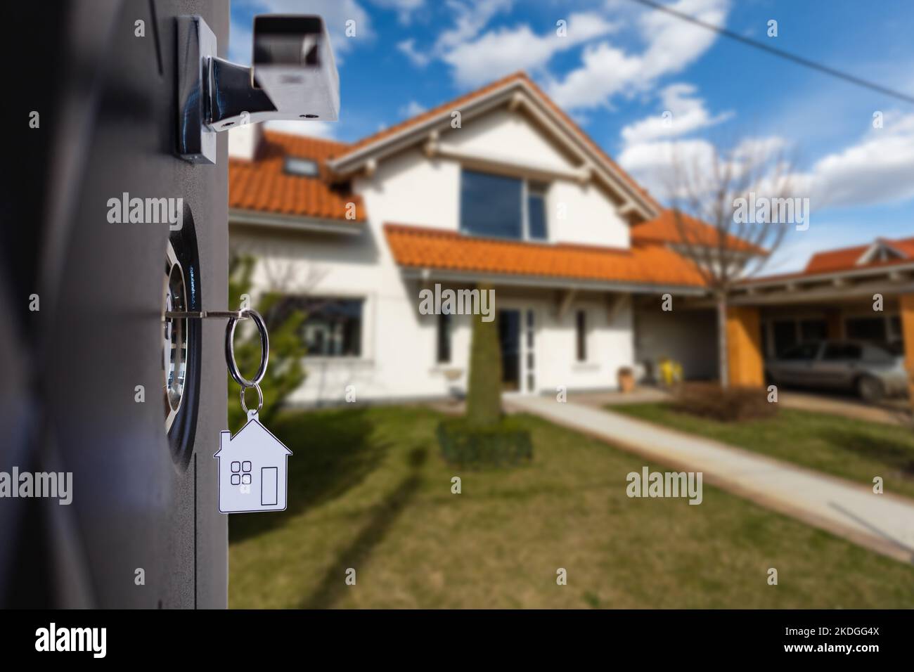 Opened door of a family home. Close-up of the lock with your keys on an ...