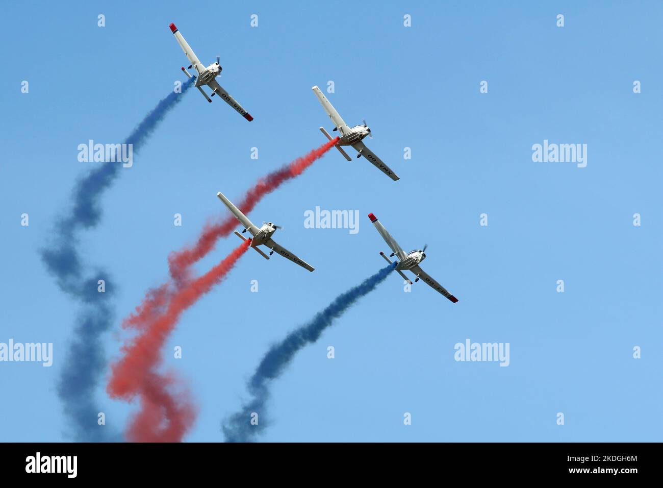 Group of aircraft flying in a formation and coloring the sky with smoke ...