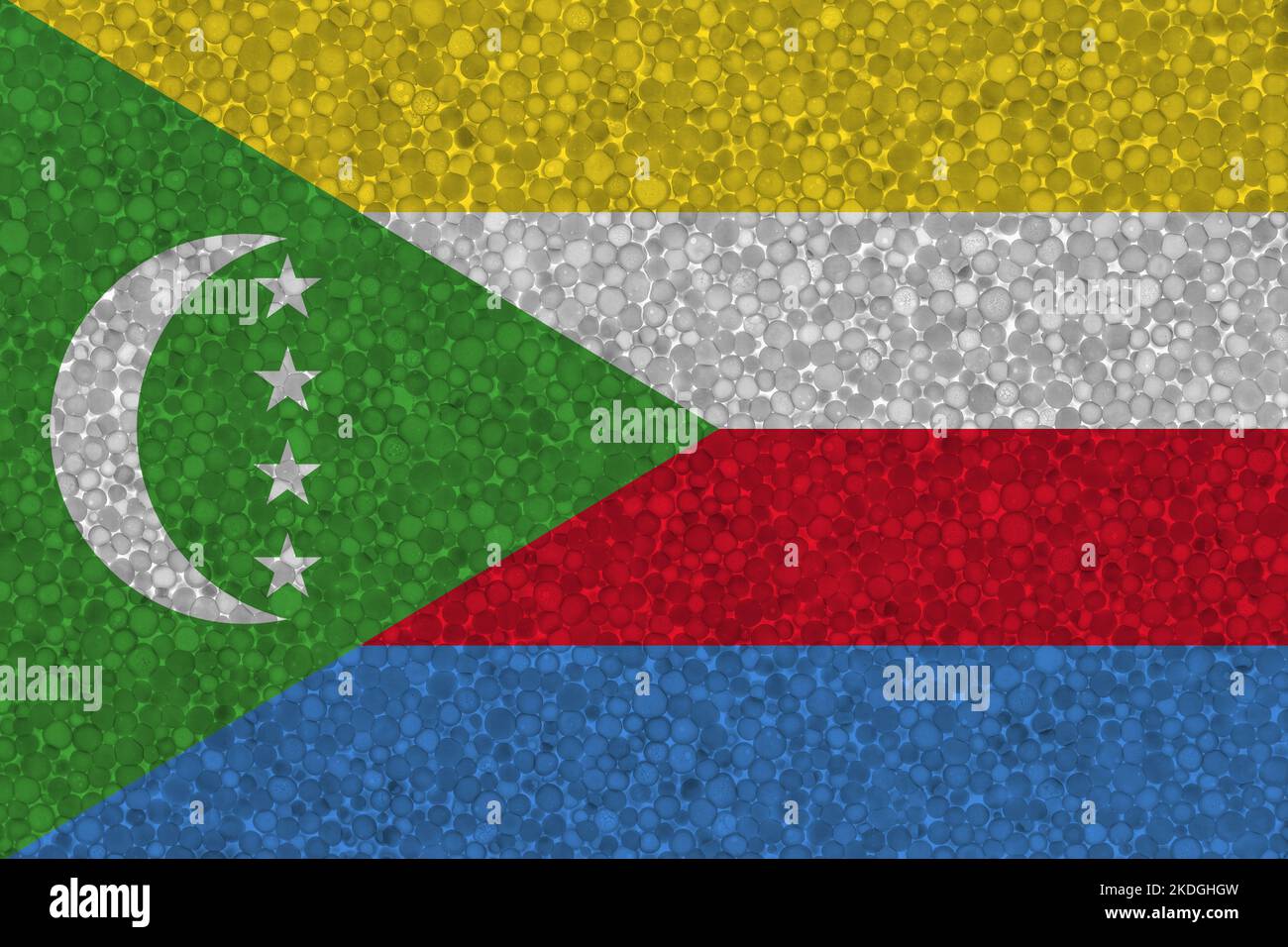 Flag of Comoros on styrofoam texture. national flag painted on the ...