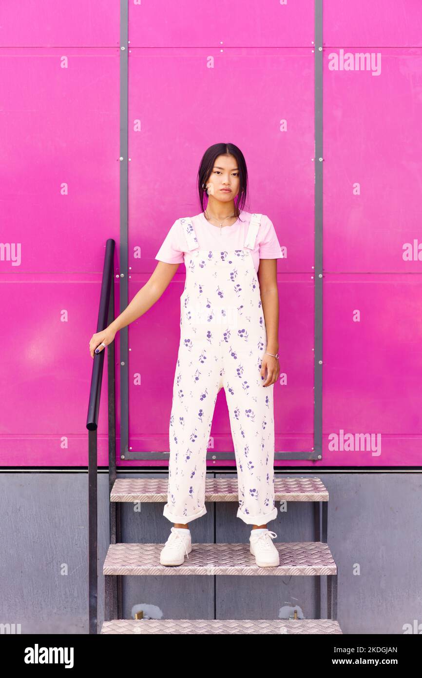 Young woman standing on step hi-res stock photography and images - Alamy