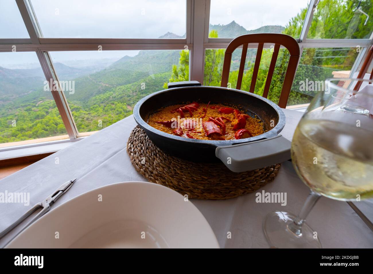 Traditional Spanish meal. Paella with a lobster. Tasty food from ...