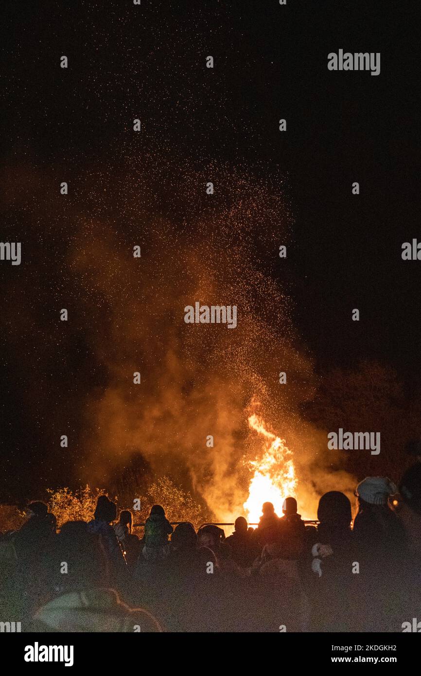 Crowd stood in front of a roaring bonfire at the annual Bicester Round ...