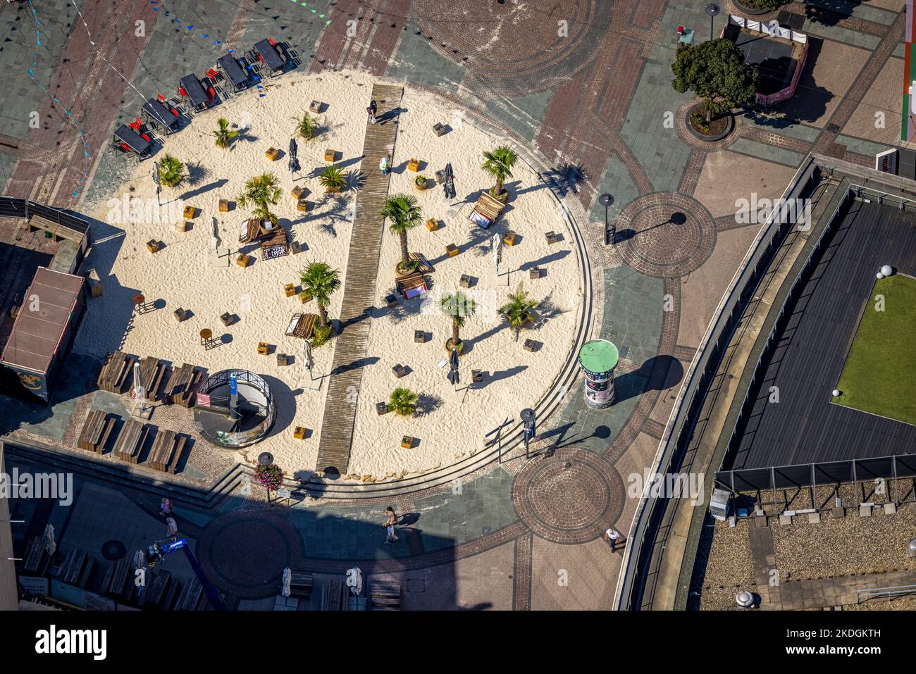 Aerial view, outdoor restaurant with sand floor and small wooden tables ...
