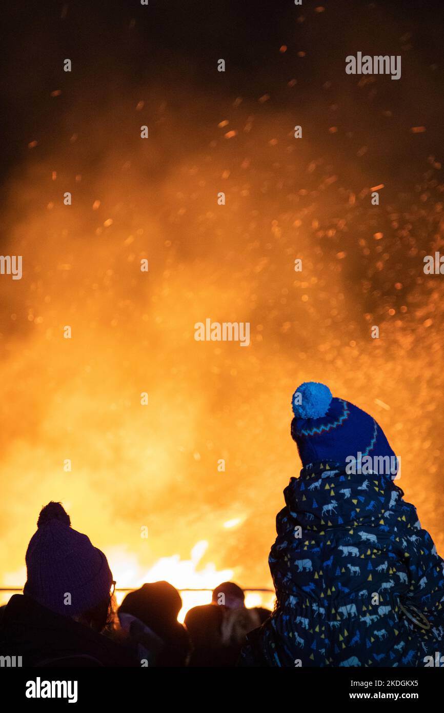 Crowd stood in front of a roaring bonfire at the annual Bicester Round ...
