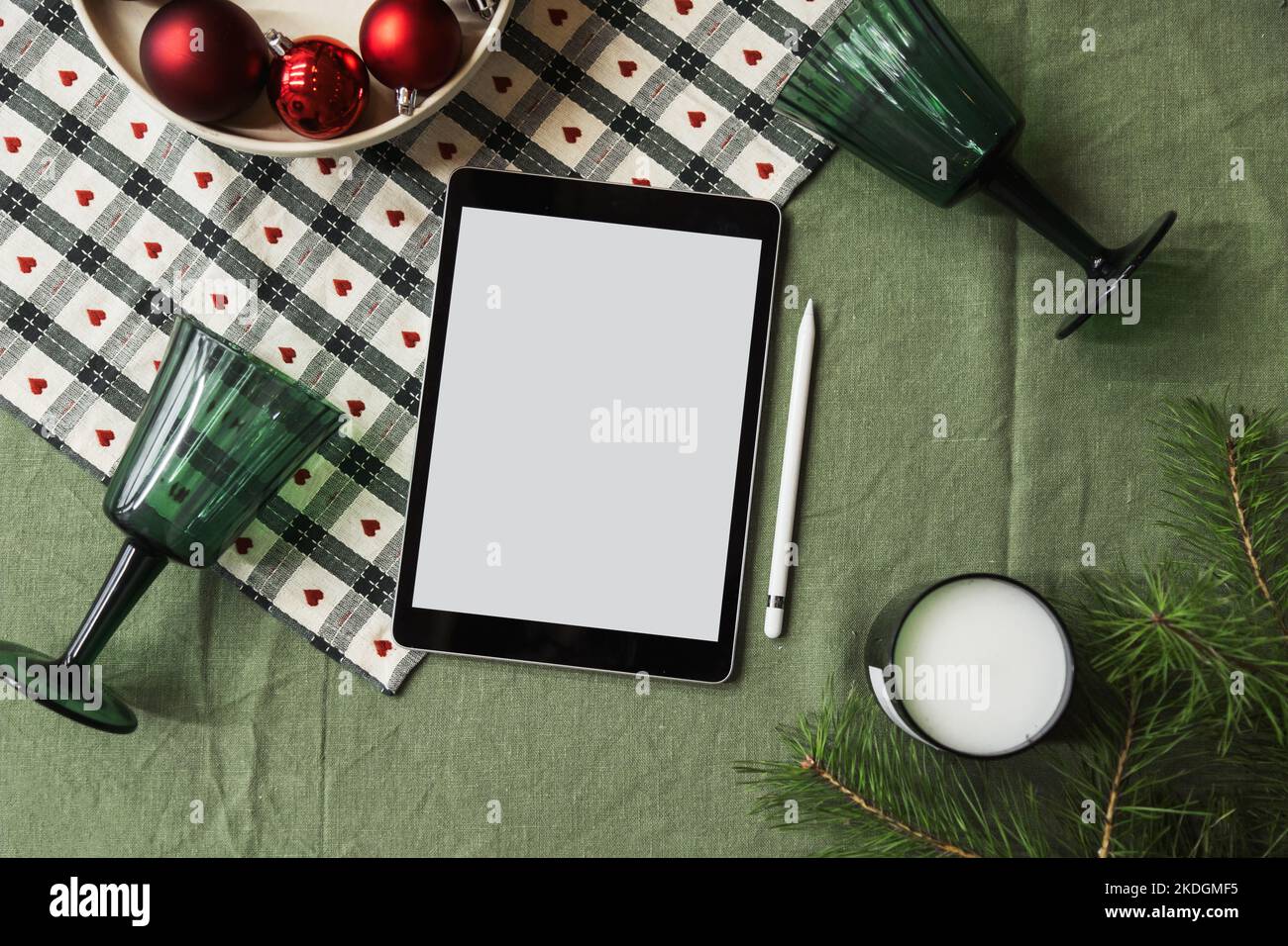 Christmas Layout on the Table with Decorations. Tablet with blank creen ...
