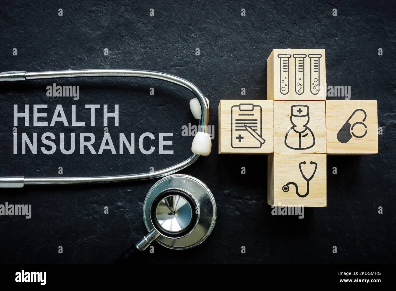 Wooden cubes and stethoscope. Health insurance concept Stock Photo - Alamy