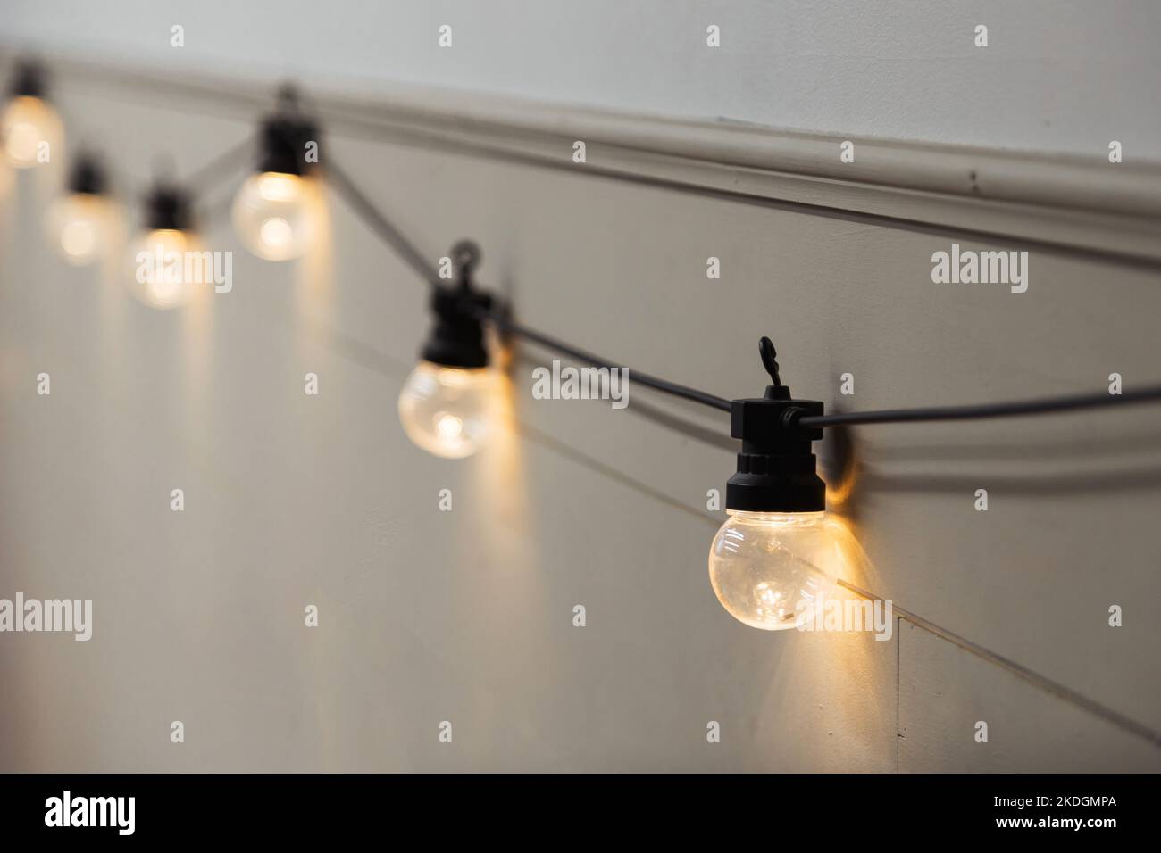 Vintage garland. Incandescent light bulbs in the cafe at the bar. Retro ...