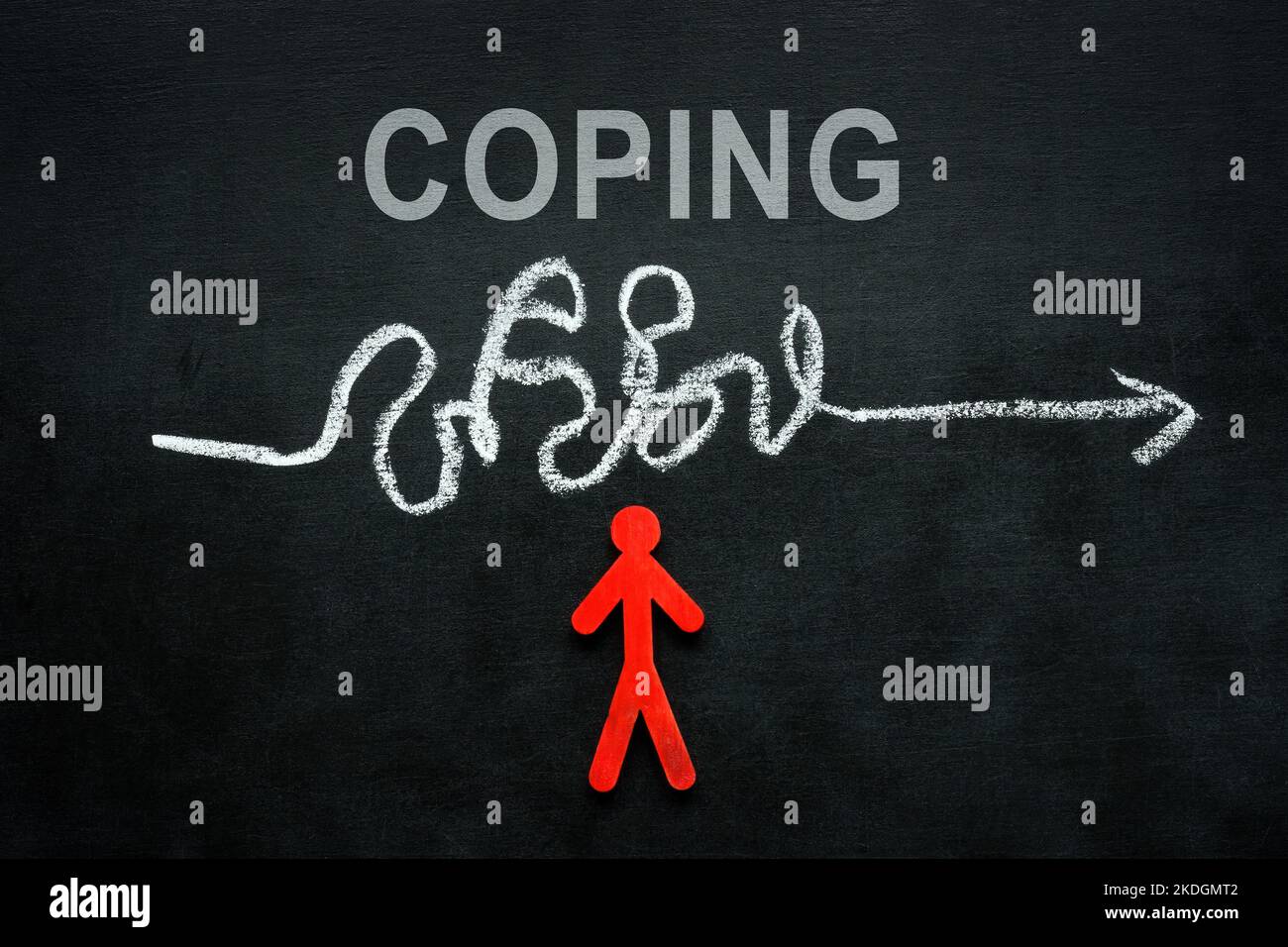 Figurine, line and word coping on the dark surface Stock Photo - Alamy