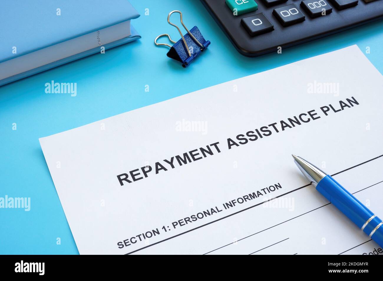 Repayment assistance plan application with pen and calculator Stock ...