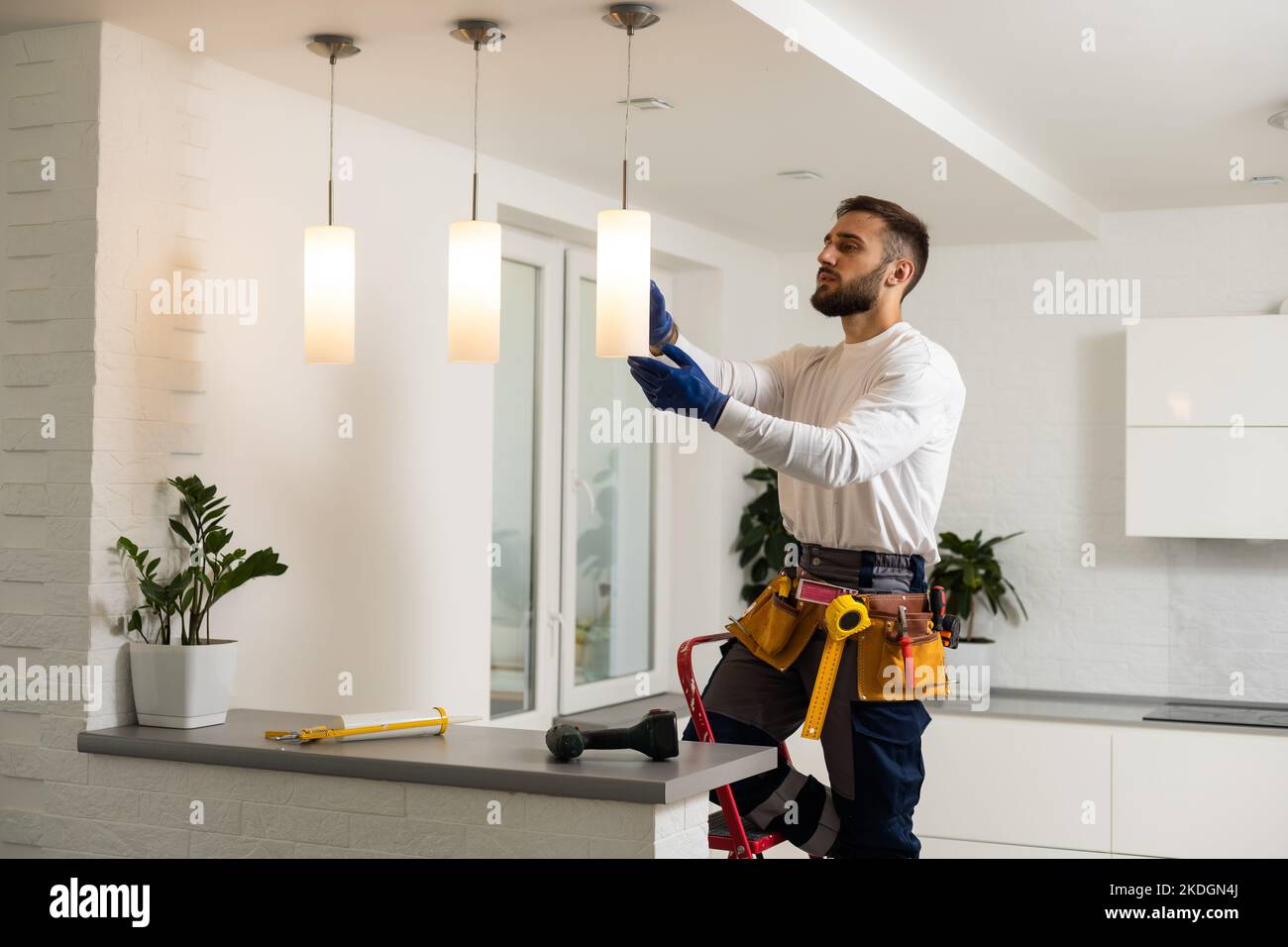 Electrician installs switch socket hi-res stock photography and images ...