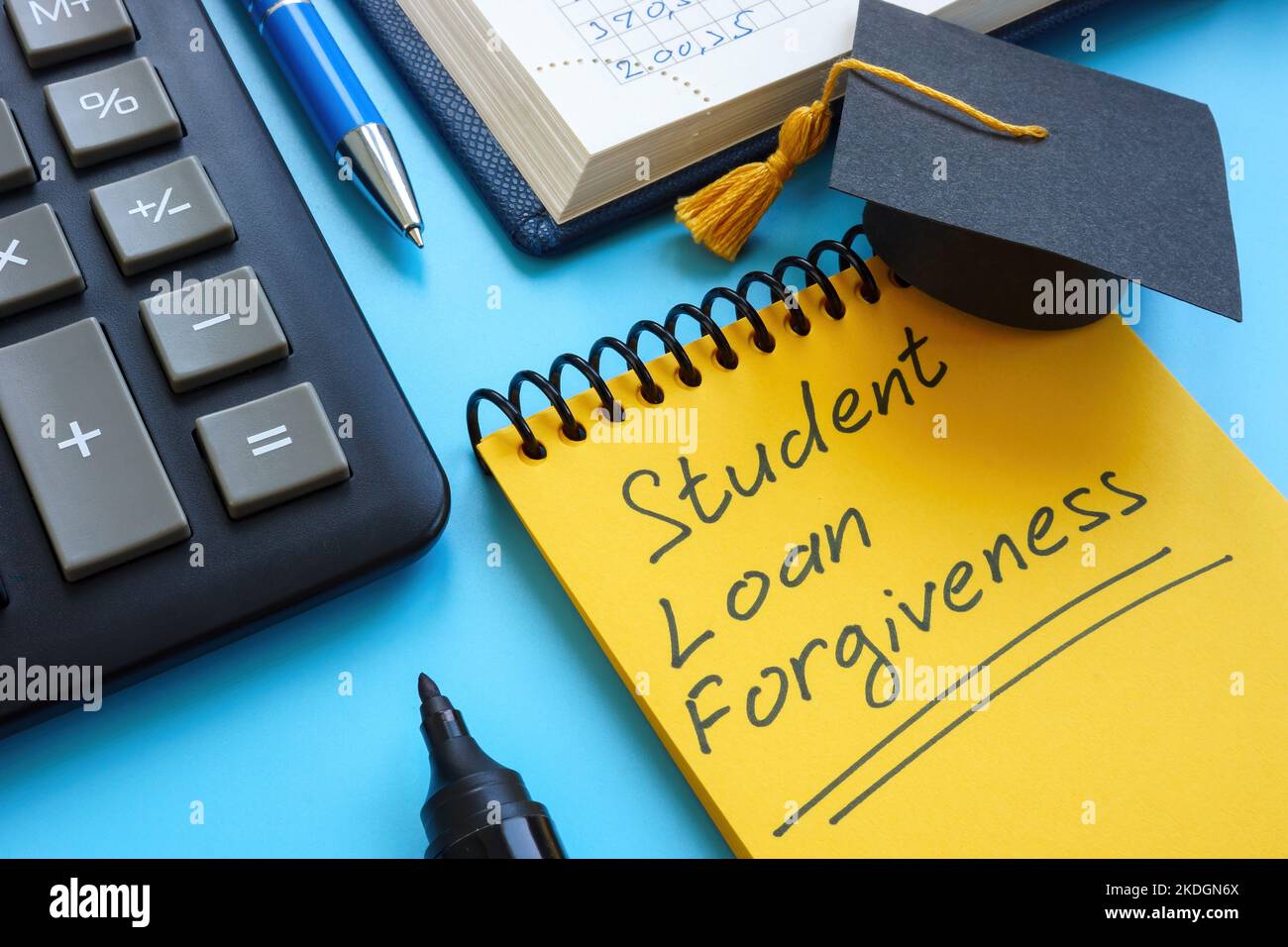 Graduation cap and Student loan forgiveness on the page Stock Photo - Alamy
