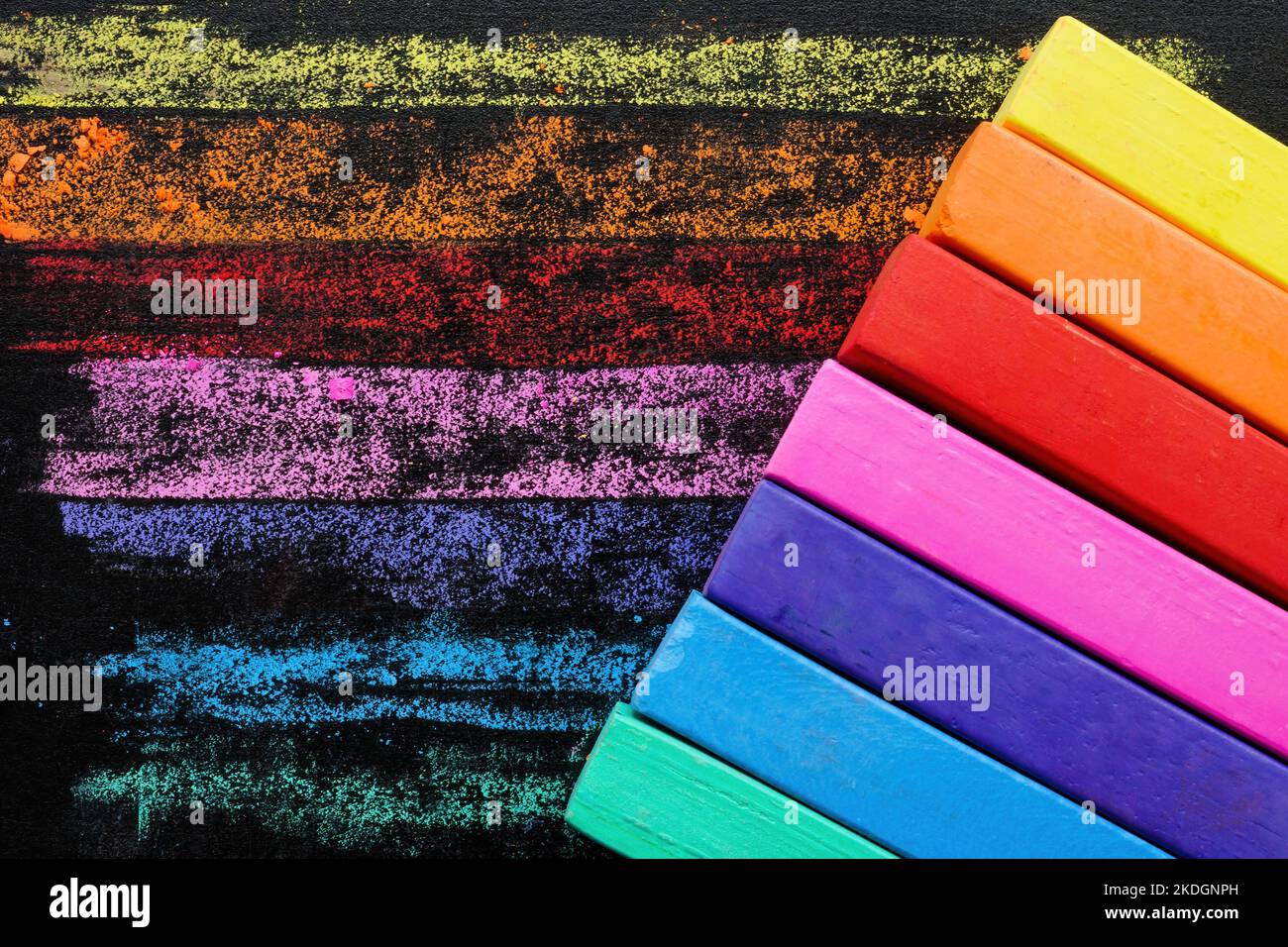 Colored crayons on a black board. Imagination concept Stock Photo - Alamy