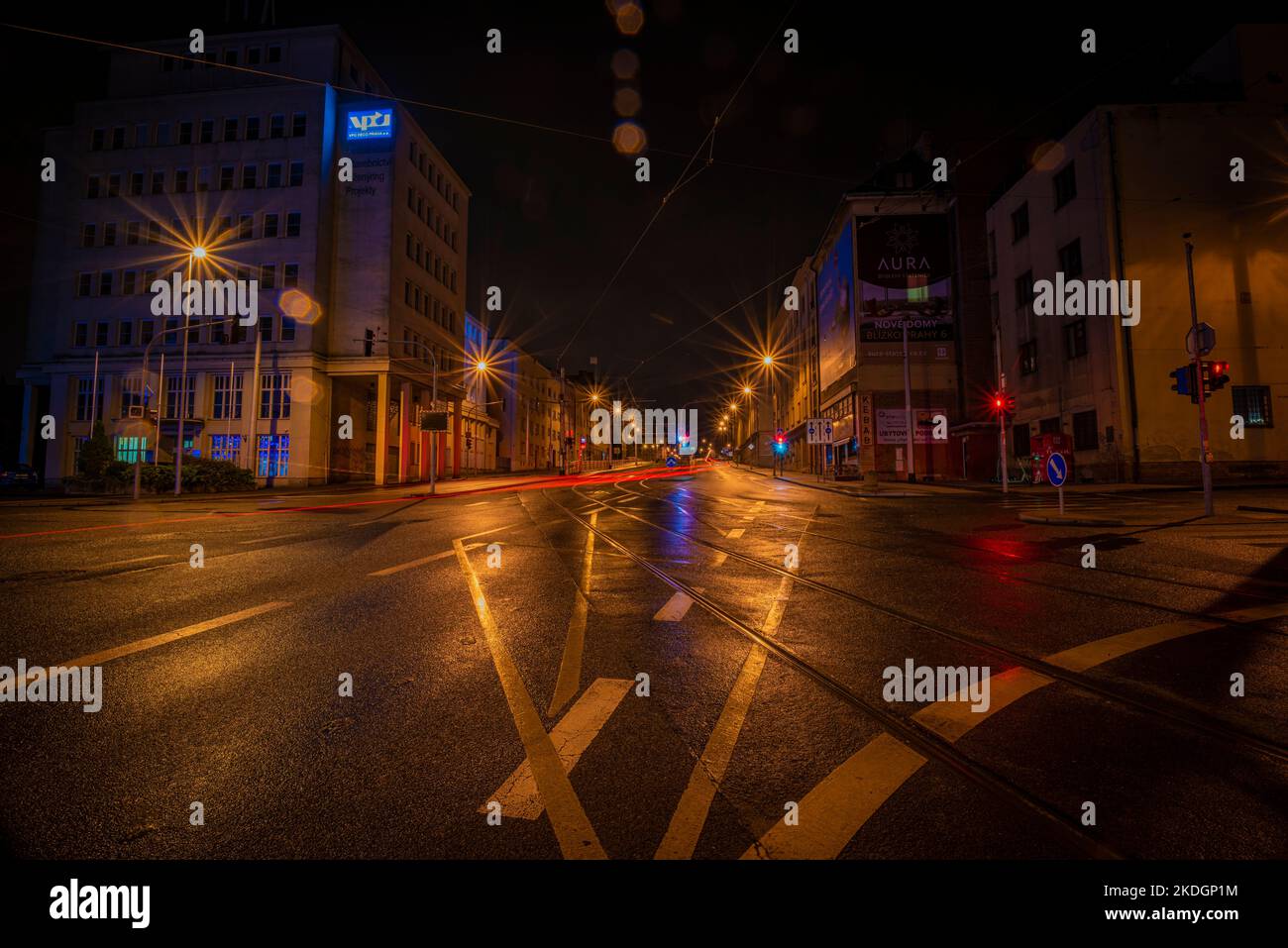 Dark orange light crossroad in capital Prague Podbaba in wet morning ...