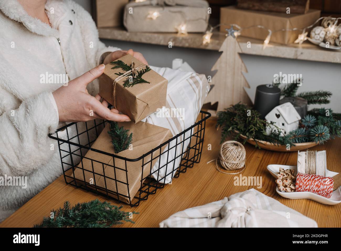 Christmas Zero waste eco friendly reuse wrapping gifts process. Woman ...