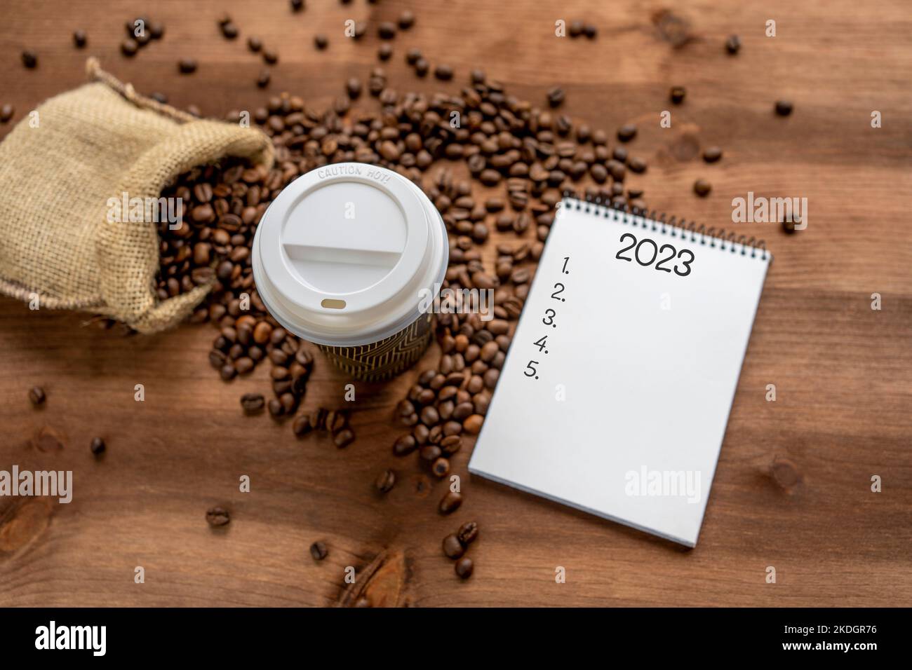 Business concept of top view 2023 goals list with notebook, take-away ...