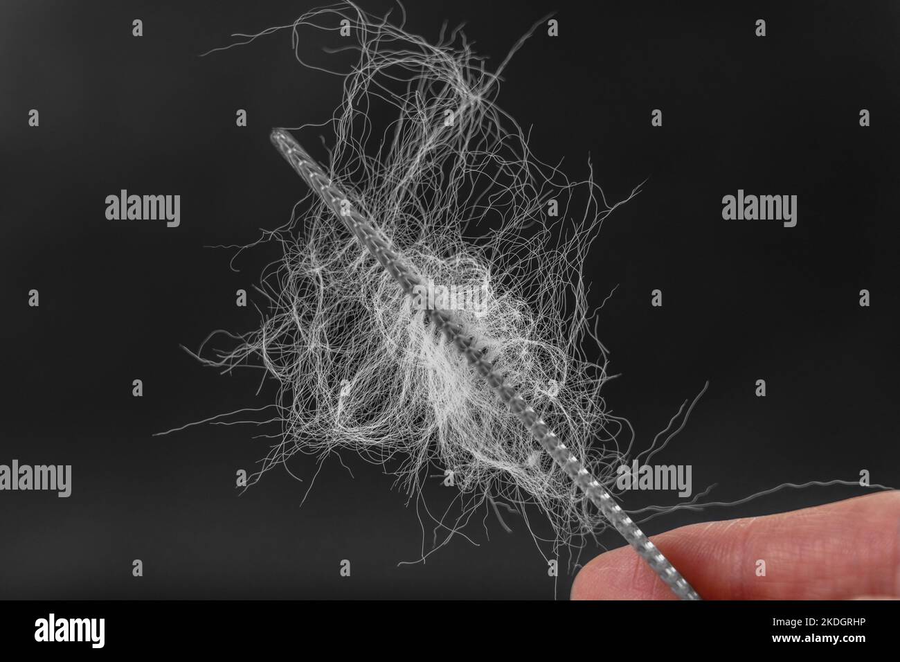 Hair loss problem with a tuft on a comb on a black background Stock ...
