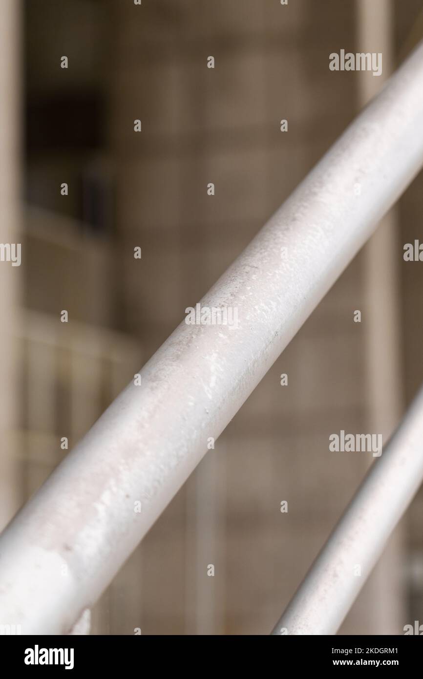 Galvanized steel street handrail on concrete building wall background ...