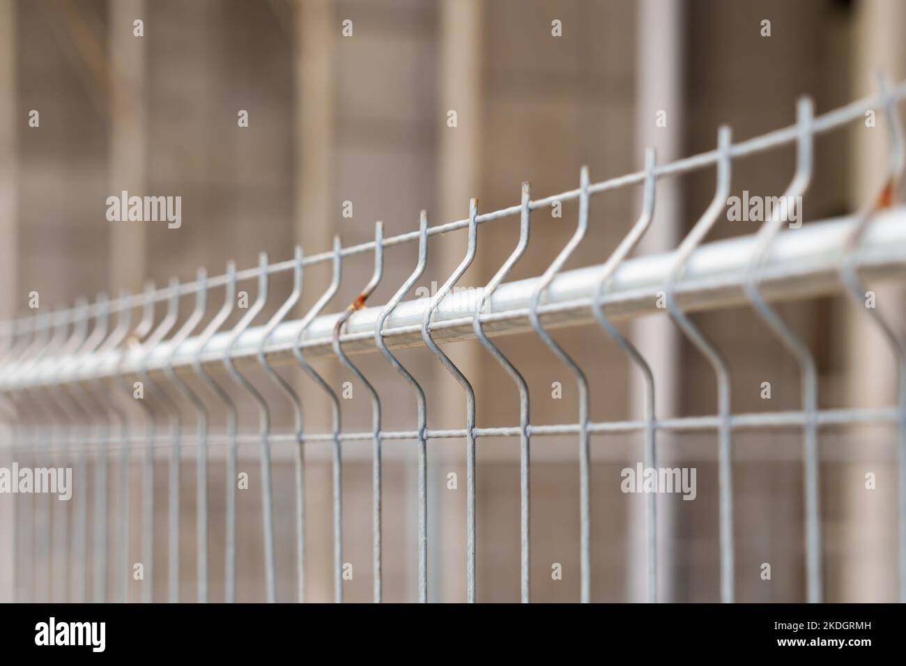 Steel mesh section of portable gray galvanized steel fence close-up ...