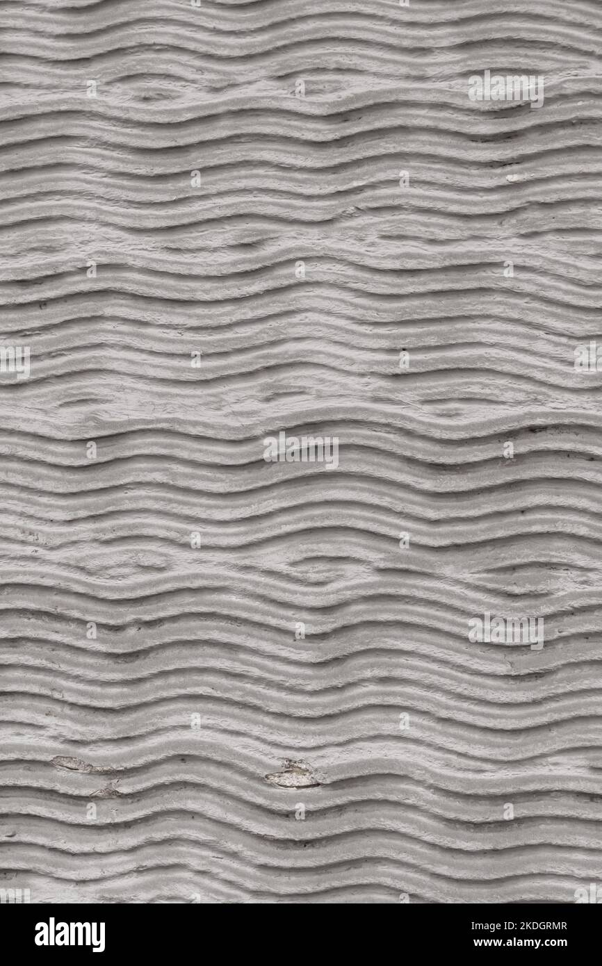 Abstract curvy cement pattern with waves on a plastered wall. Creative ...
