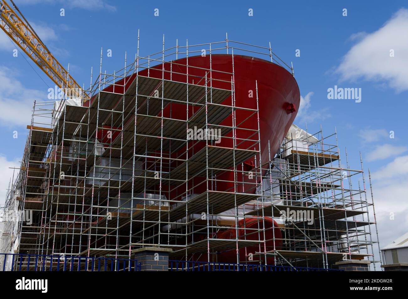 Shipbuilding and crane during ferry construction surrounded by scaffold ...