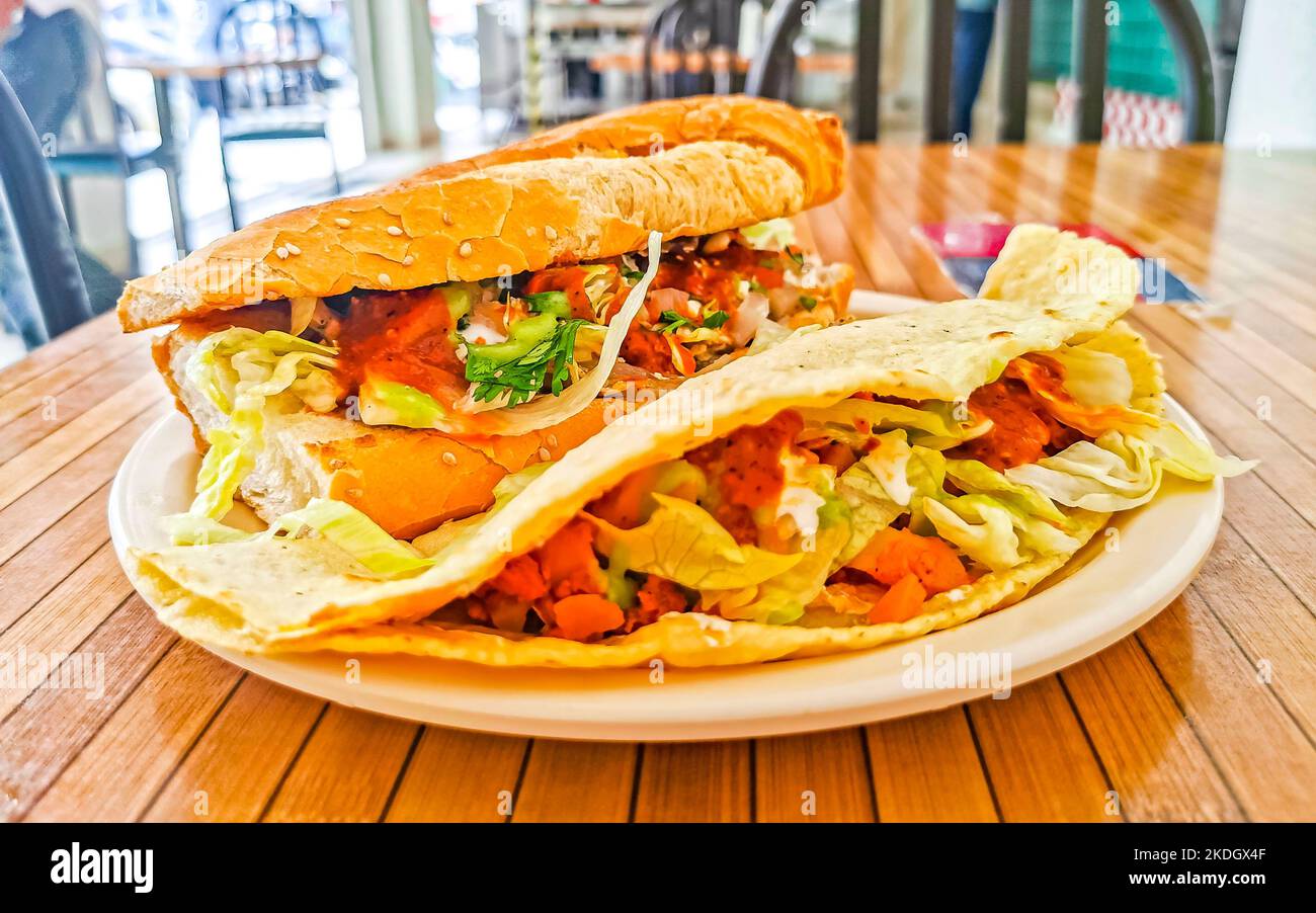 Typical Mexican dishes Tortas Tacos Empanadas and Tamales in Cancun ...